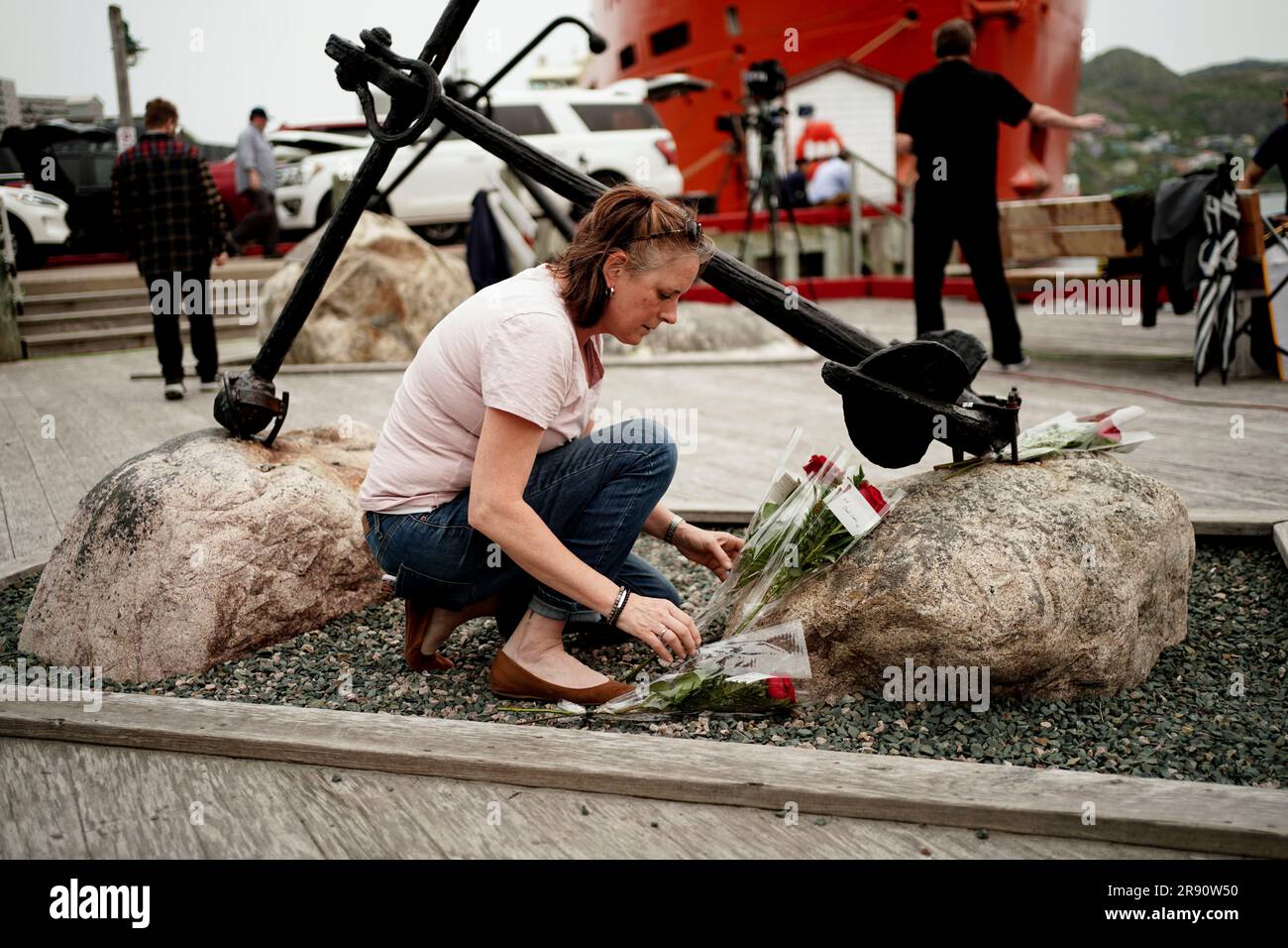 St John's resident Patsy Power places flowers at an anchor at King's ...