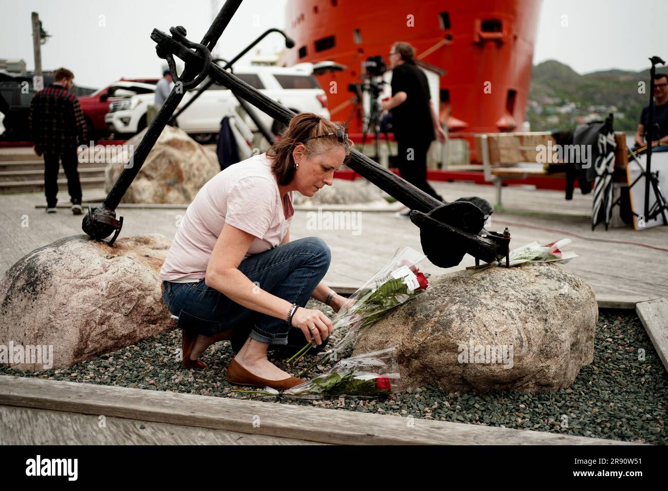 St John's resident Patsy Power places flowers at an anchor at King's ...