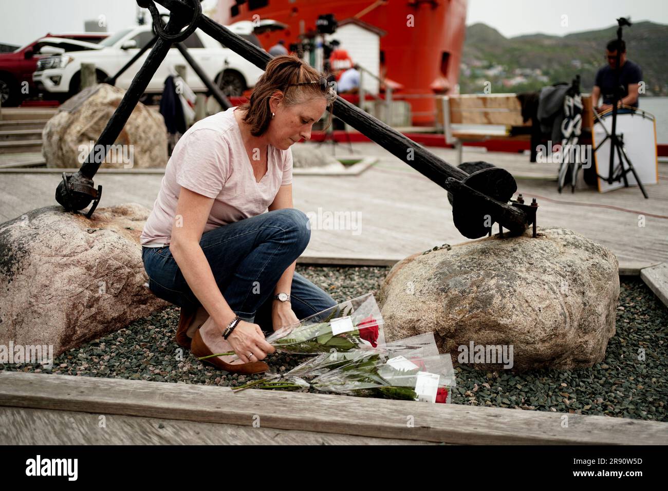 St John's resident Patsy Power places flowers at an anchor at King's ...