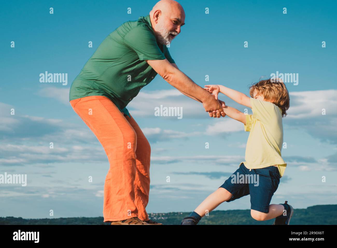 Grandfather helping hand. Child rearing. The educative process needs to ...