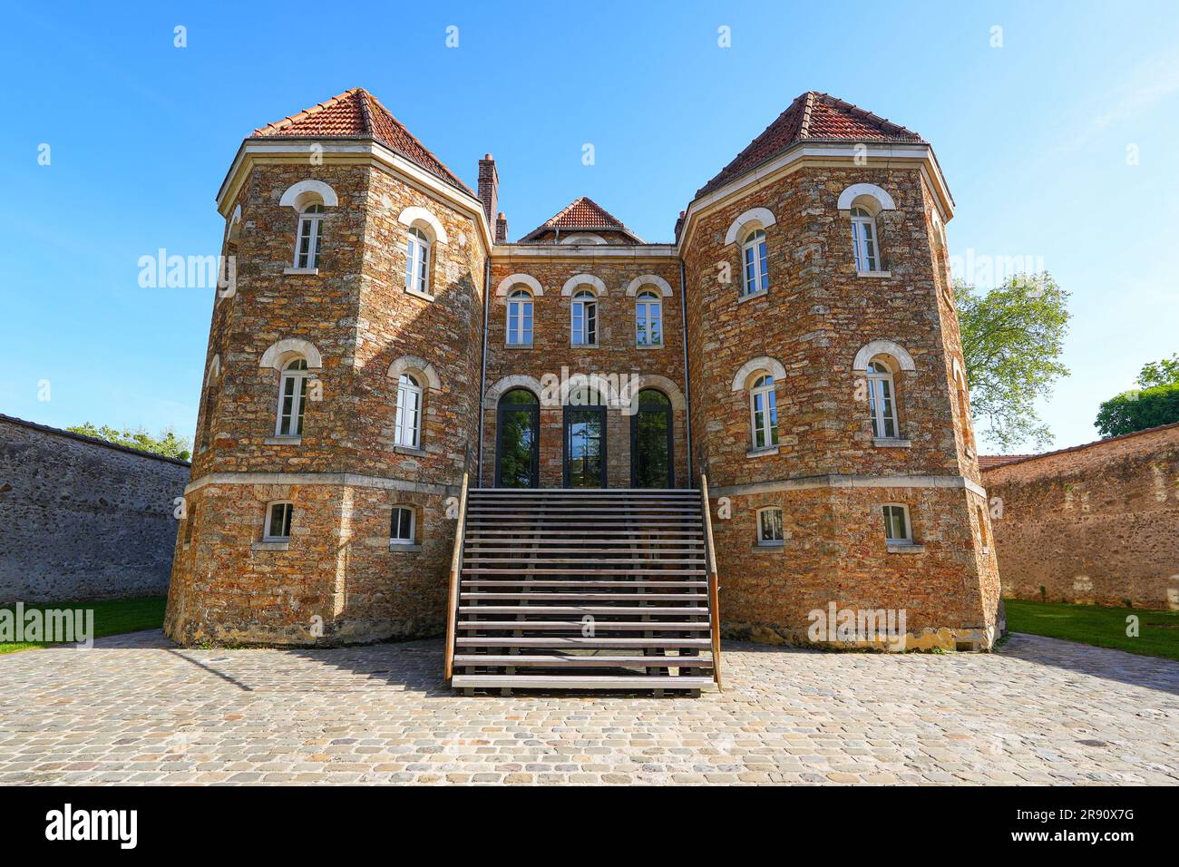Stone facade of the City Library of Coulommiers, housed in a former ...