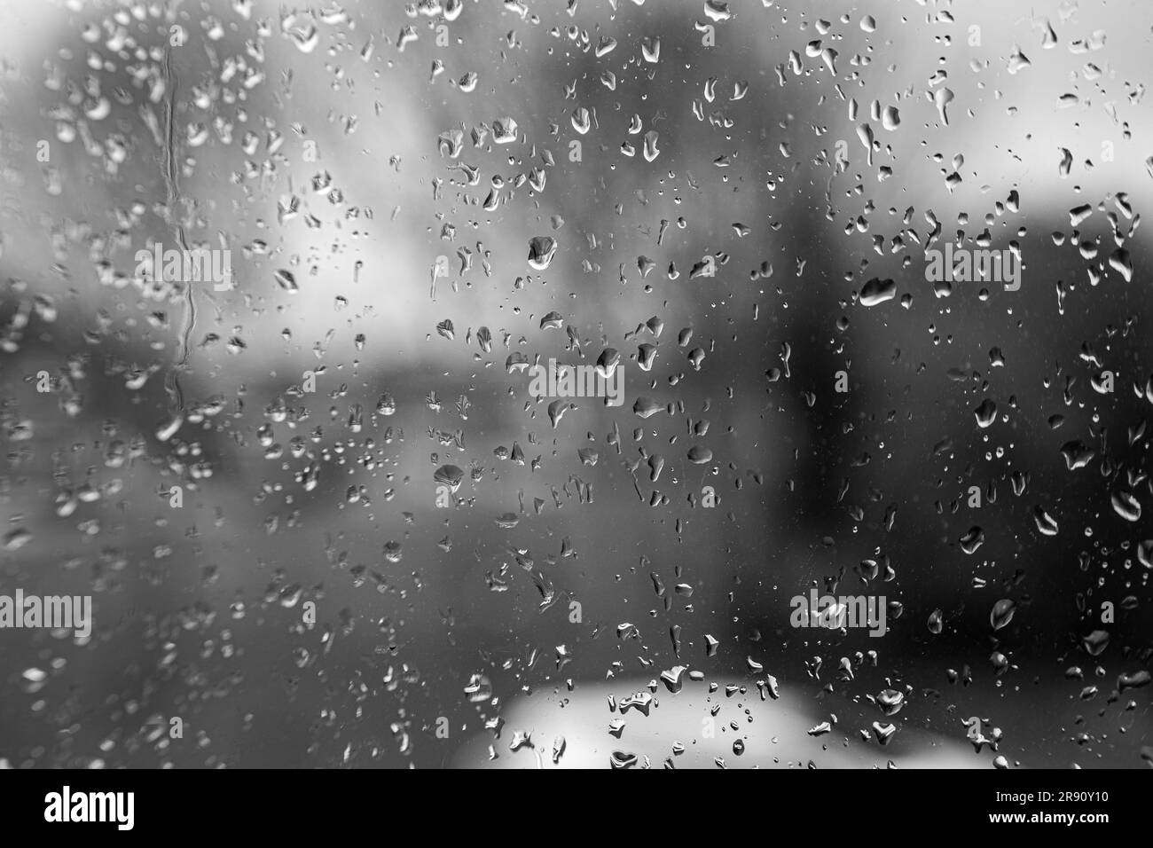 Rain drops on blurred background Black and White Stock Photos & Images ...