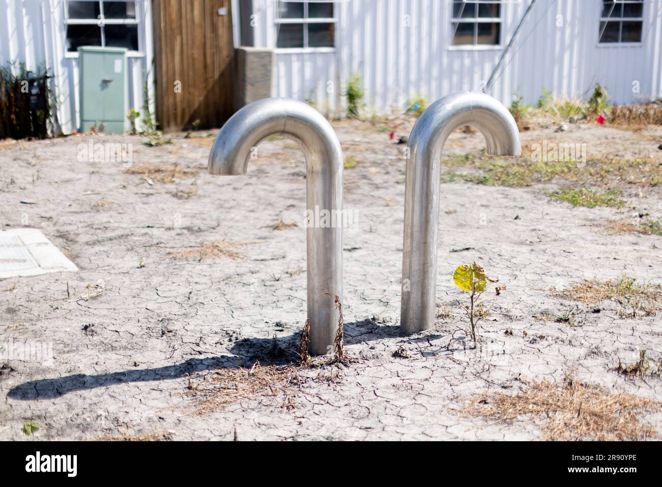 Stainless steel J-shaped vent/exhaust pipes emerging from the ground ...