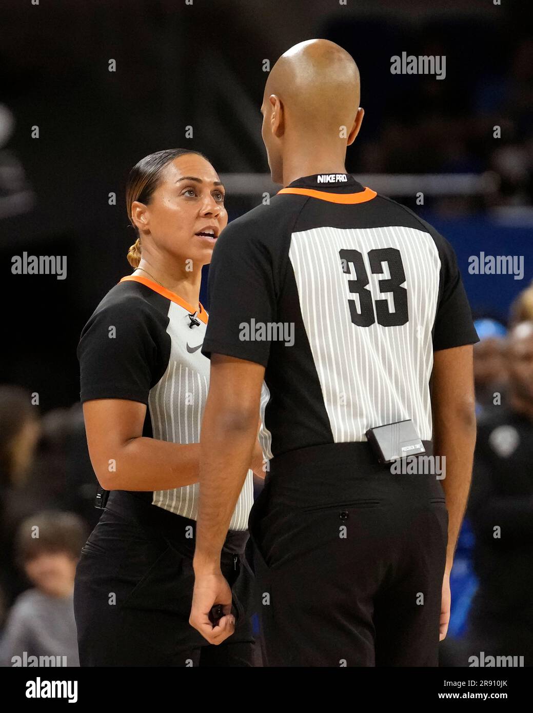 WNBA referees Sha'Rae Mitchell, left, and Biniam Maru confer during a ...