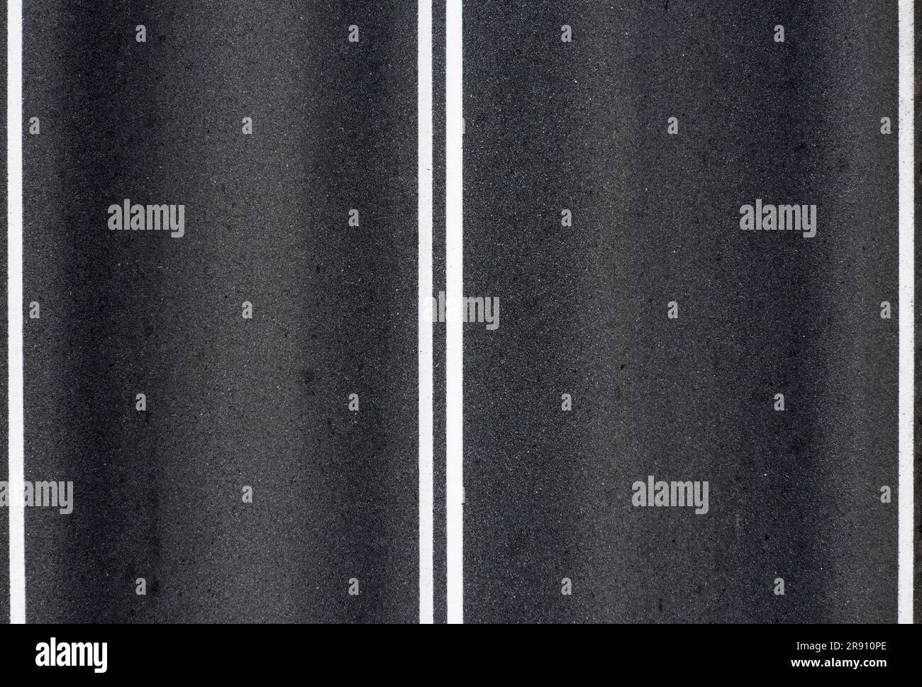 Double white lines on the background of an asphalt road. View from ...