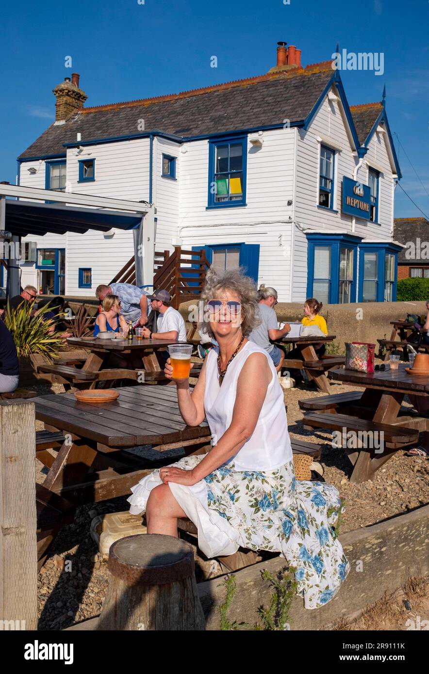 Whitstable North Kent , England UK - Female tourist enjoys a beer ...
