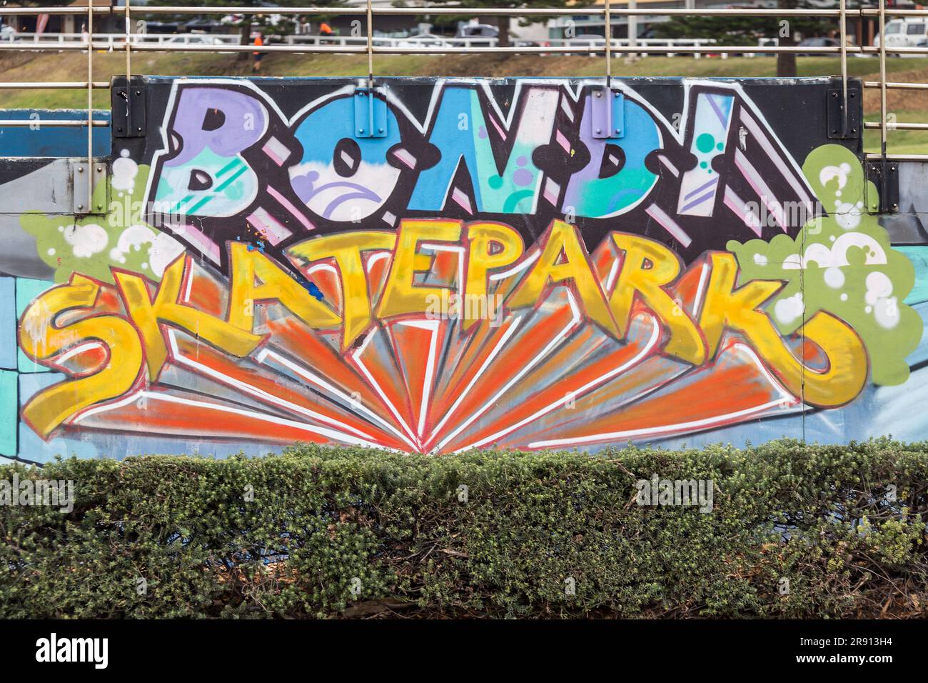 Colorful graffiti art line a wall along the famous Bondi Beach outside ...