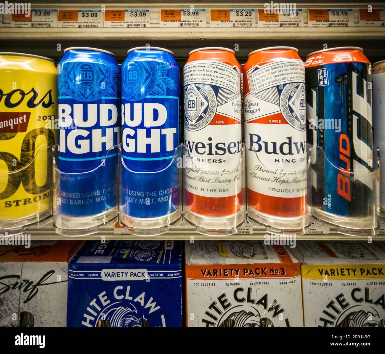 Cans of beer in a supermarket, including Budweiser and Bud Light, in ...