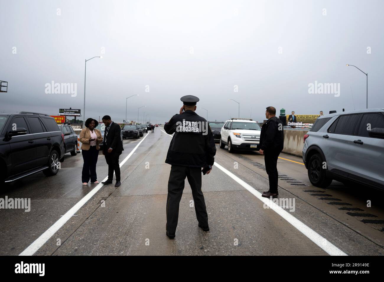 A Pennsylvania state trooper stands as Interstate 95 is set to reopen ...