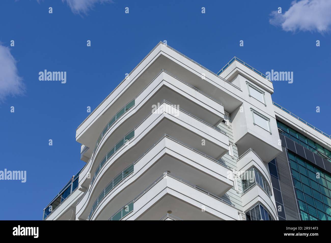 Part of a beautiful white building against the sky with clouds Stock ...