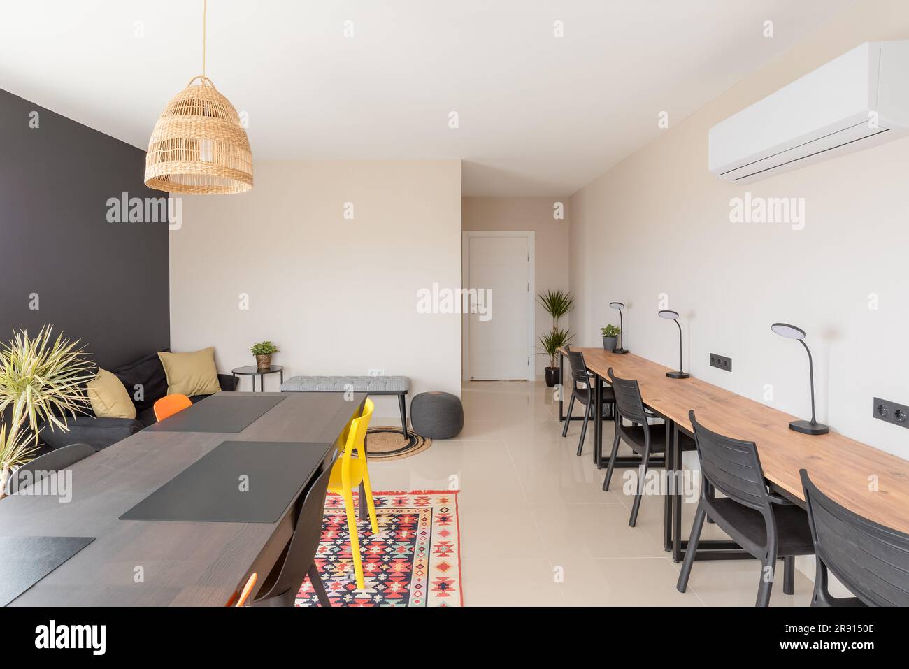 View of the interior of an office space with working tables, tables ...
