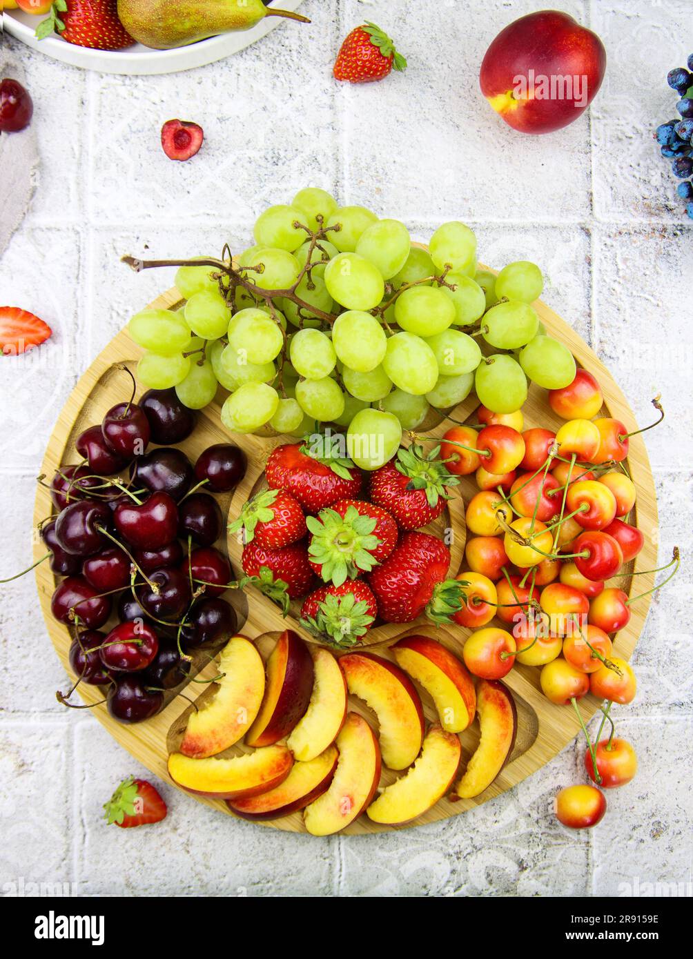 Rich fruit plate filled with fruits and berries. Assortment of black ...