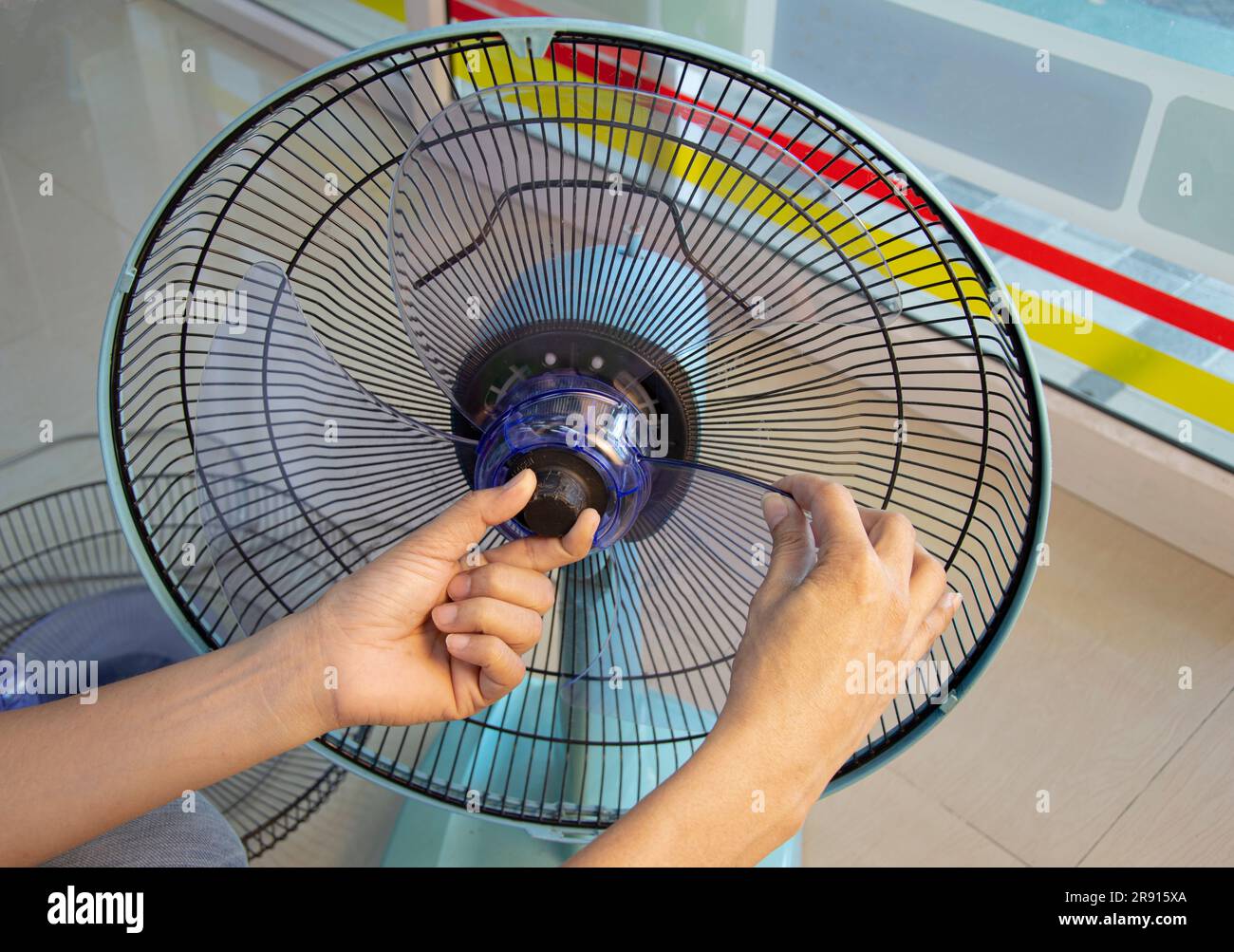 Technician repairing fan, replacing impeller Stock Photo - Alamy