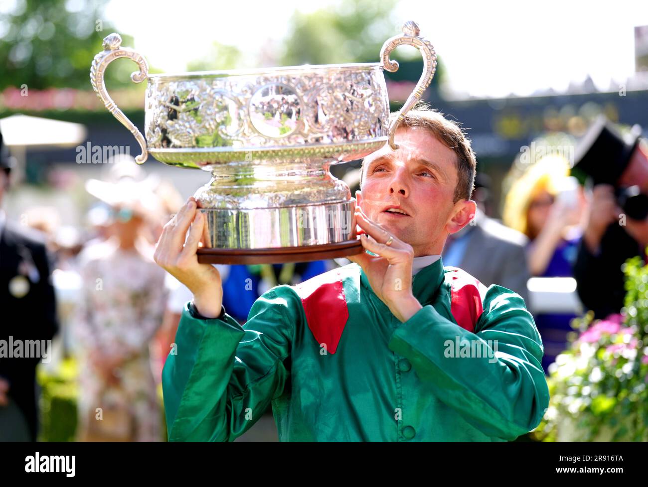 Jockey Chris Hayes celebrates with the trophy after winning the ...