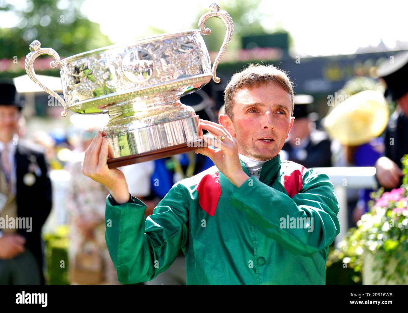 Jockey Chris Hayes celebrates with the trophy after winning the ...