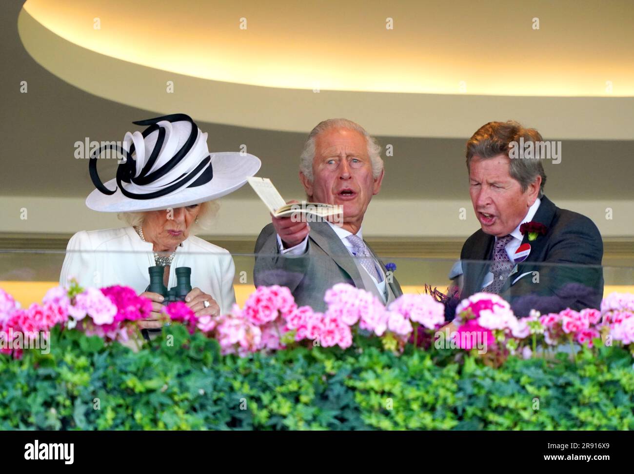 King Charles III and Queen Camilla watch the Sandringham Stakes from ...