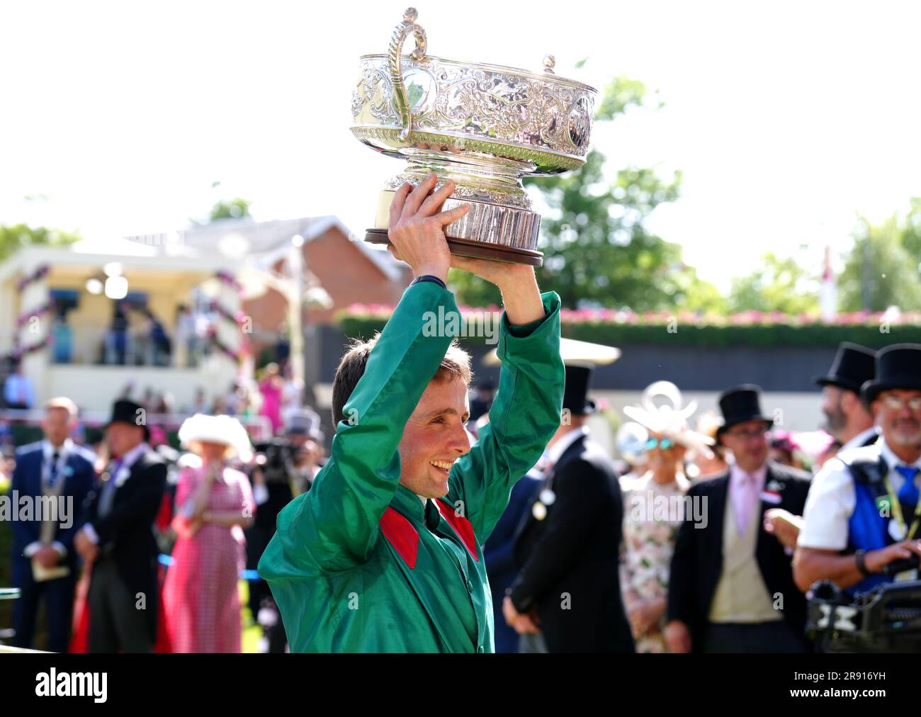 Jockey Chris Hayes celebrates with the trophy after winning the ...