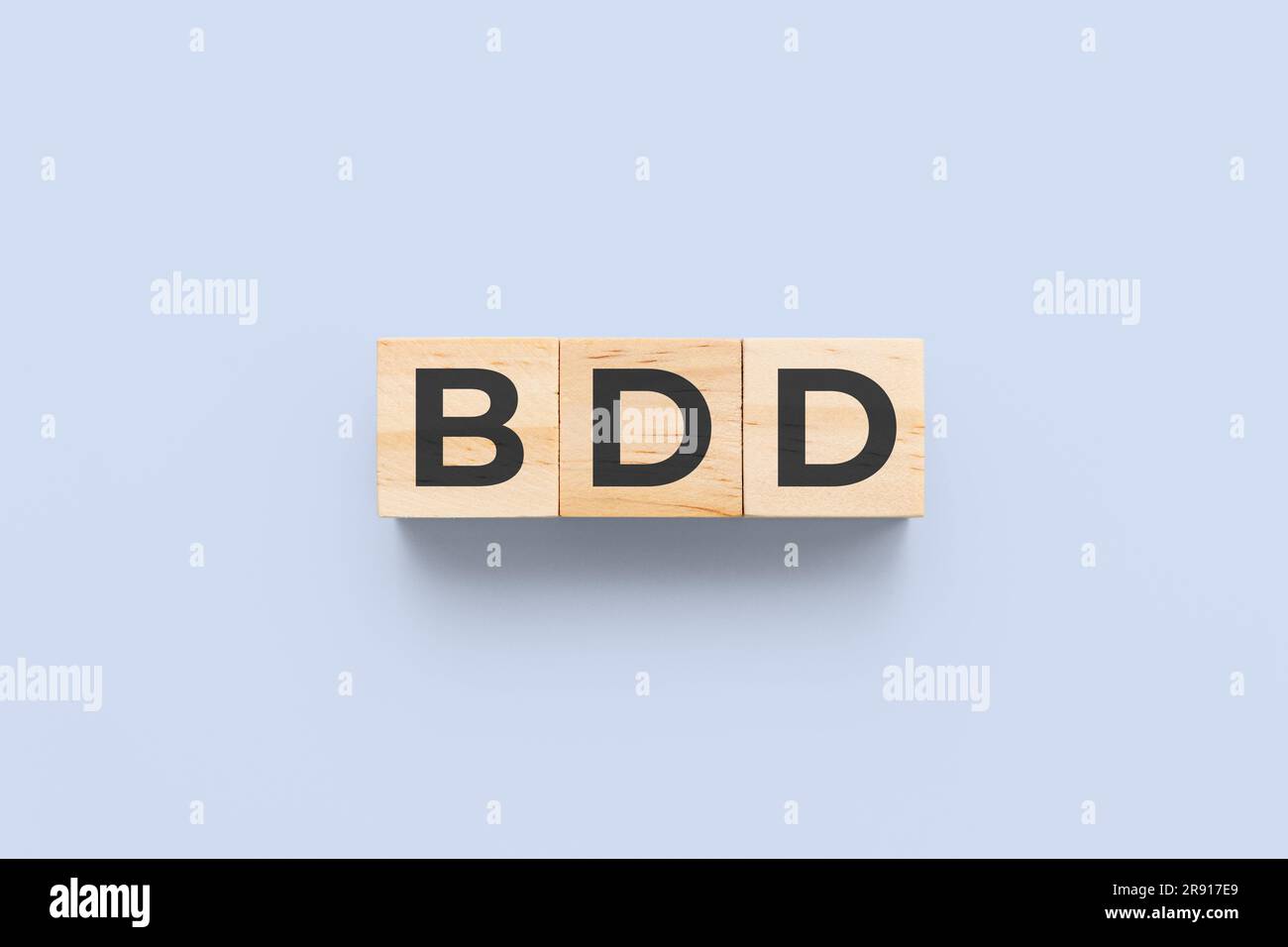 BDD (Body Dysmorphic Disorder) wooden cubes on blue background Stock ...