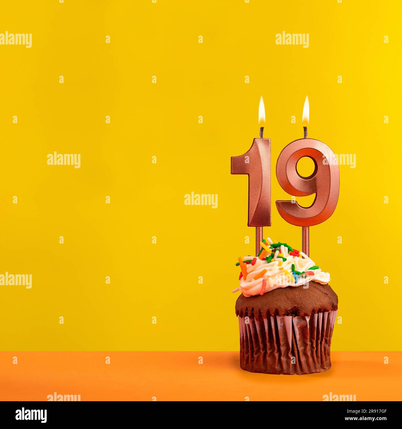 Candle with flame number 19 - Birthday card on yellow background Stock ...
