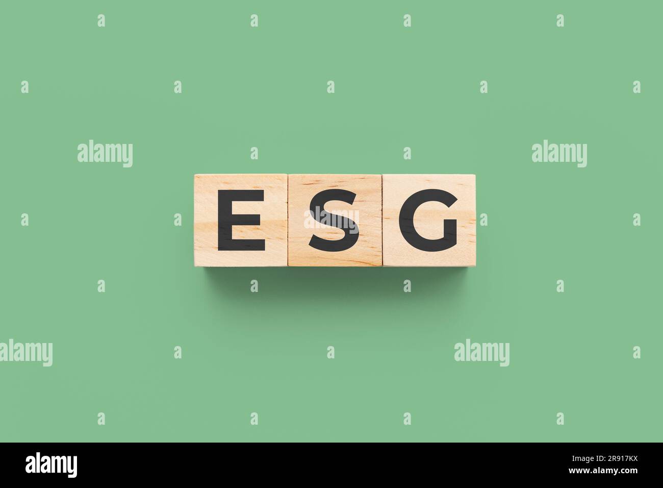 ESG (Environmental, Social and Governance) wooden cubes on green ...
