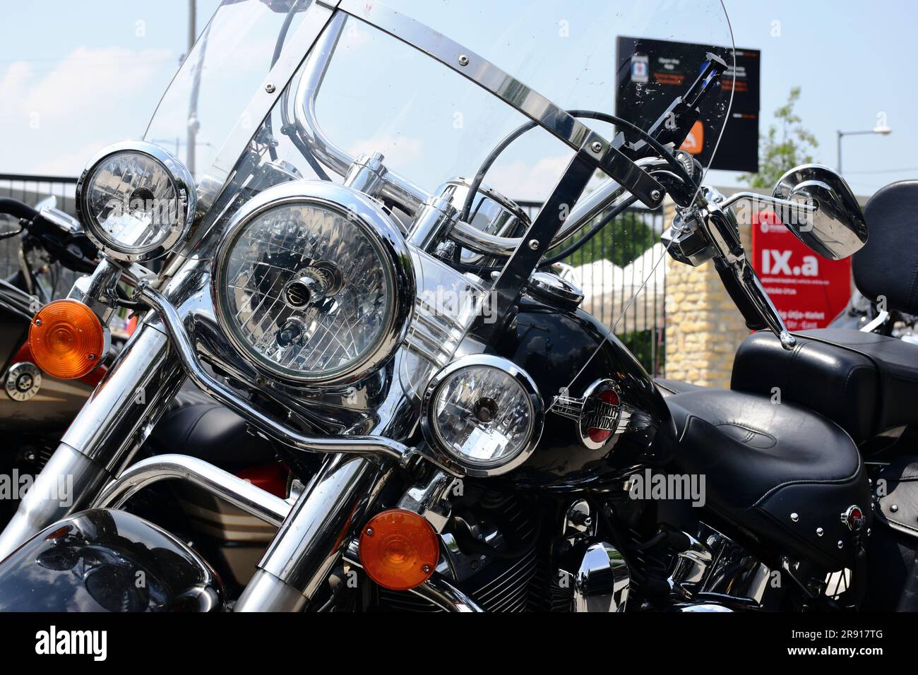 headlight closeup of popular large American made motorcycle. glass lens ...