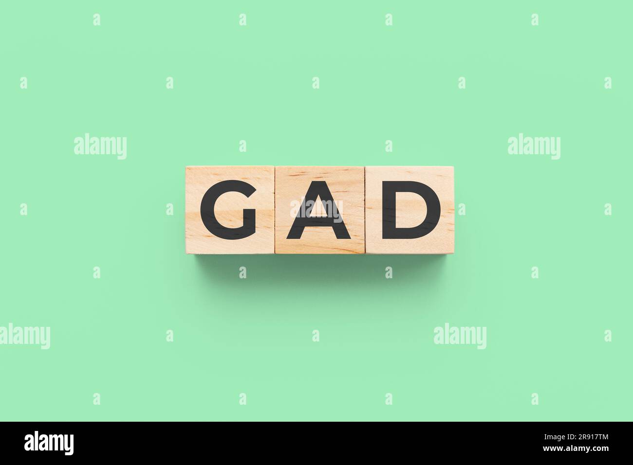 GAD (Generalized Anxiety Disorder) wooden cubes on green background ...