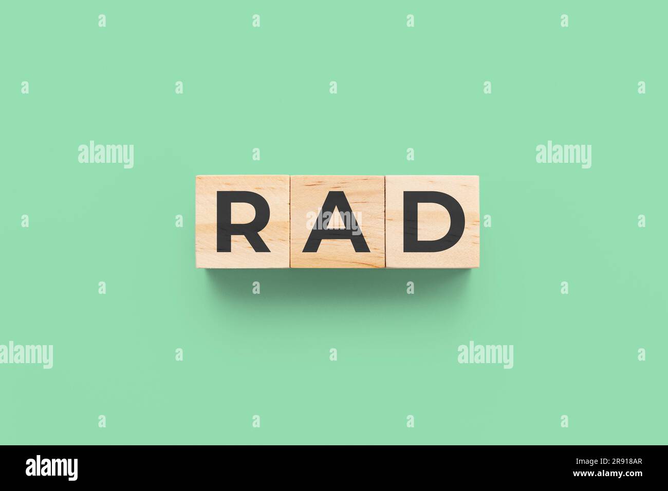 RAD (Reactive Attachment Disorder) wooden cubes on green background ...