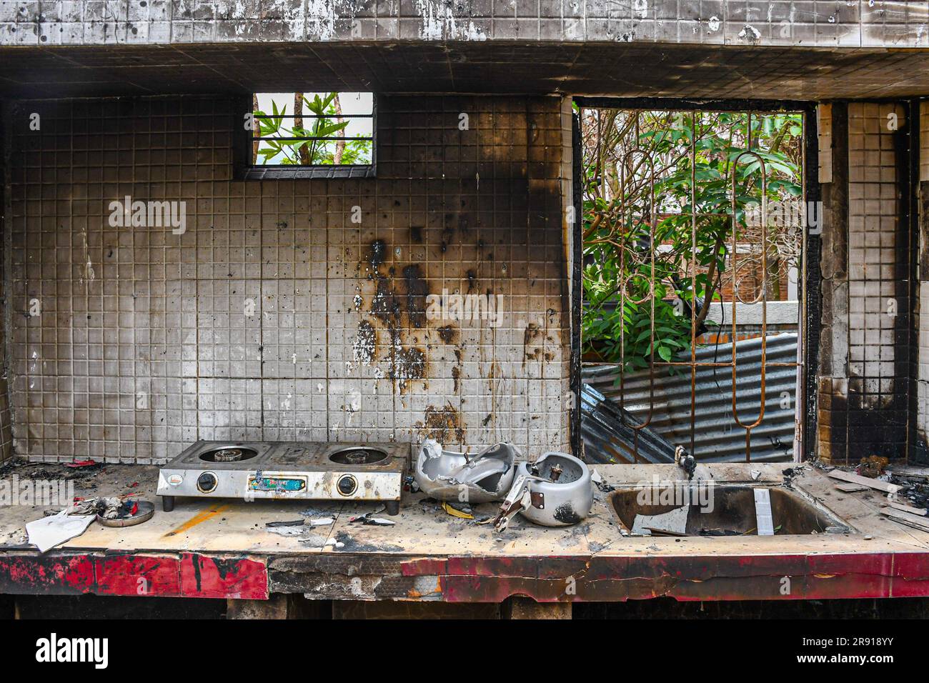 The remains of burnt kitchen are seen in Torbung village, located about ...