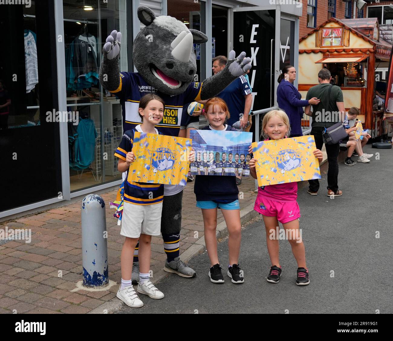 Leeds Rhinos fans pose for a photo with Mascot, Ronnie the Rhino before ...