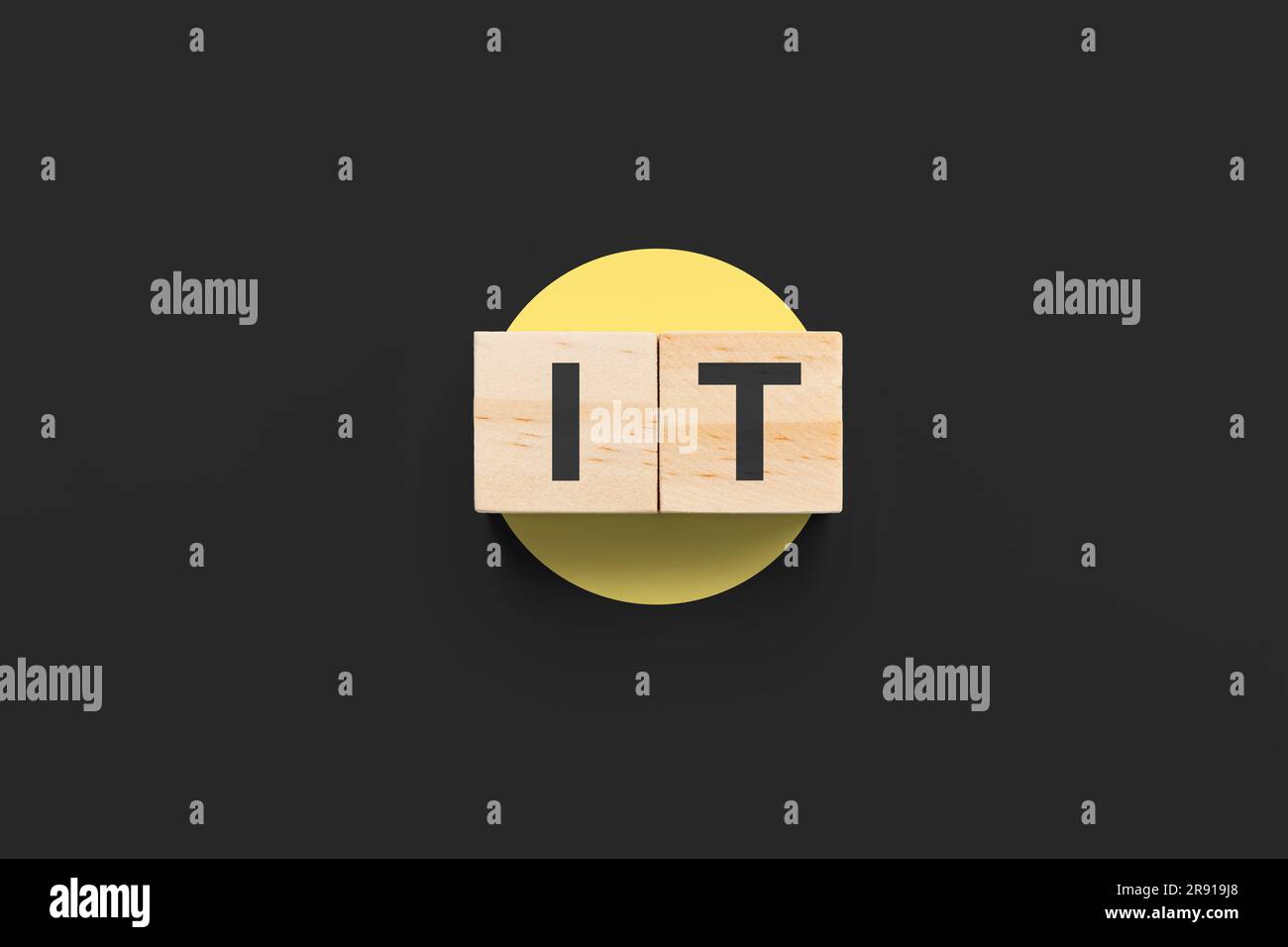 IT (information technology) wooden cubes on black background with ...