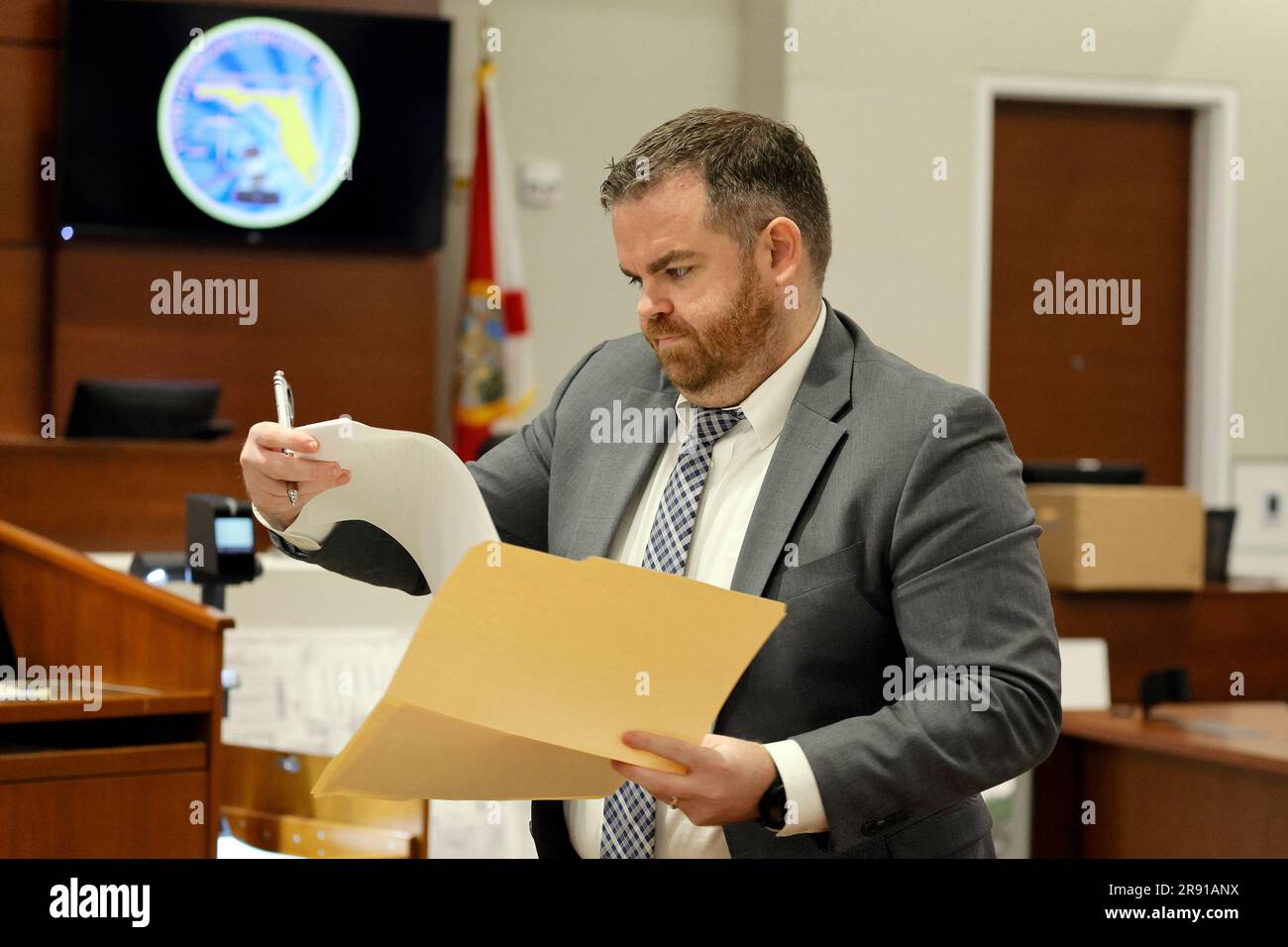 Assistant State Attorney Christopher Killoran looks at papers during the trial of former Marjory ...