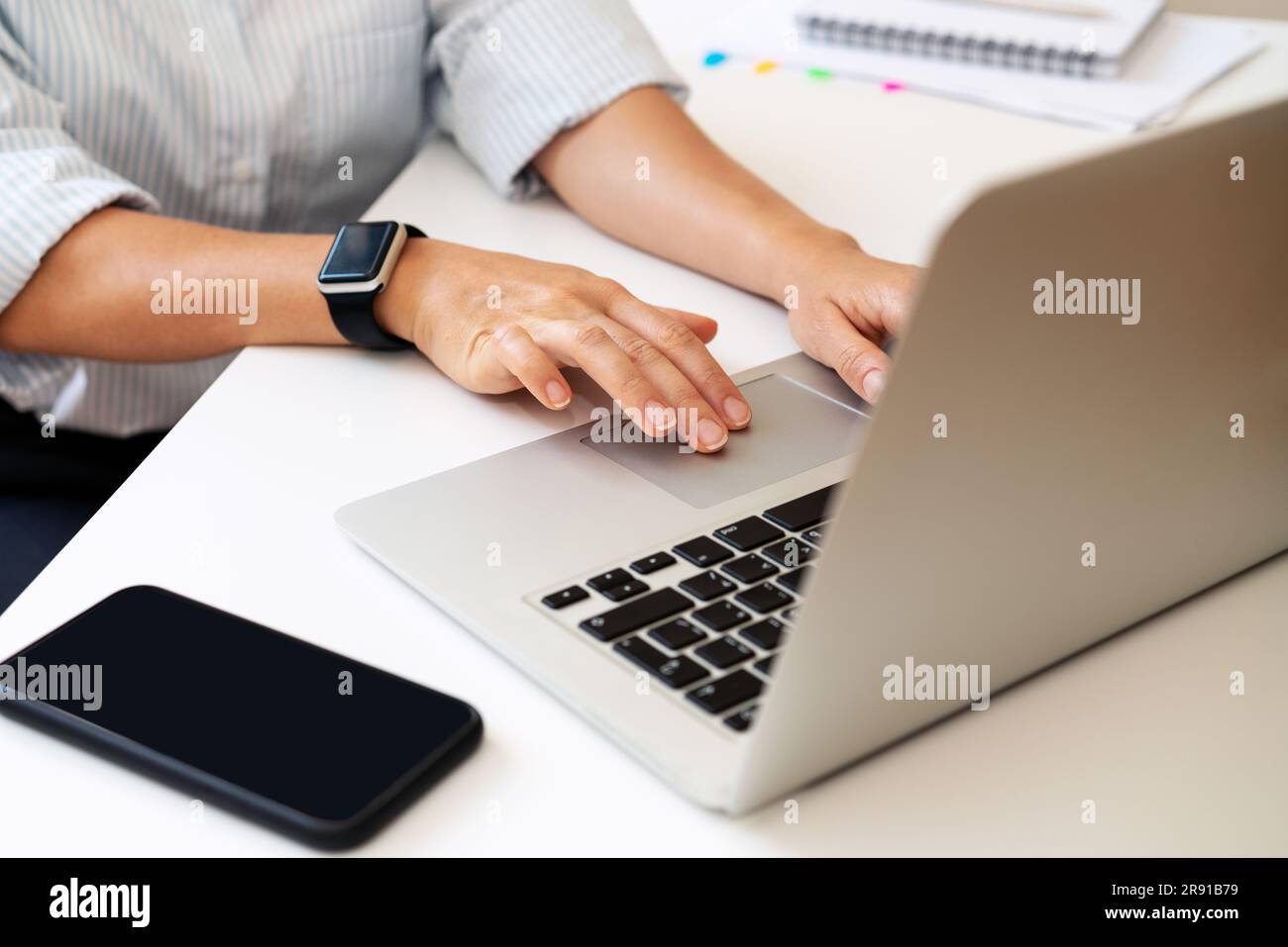 Close up photo of females fingers on the touchpad of laptop, woman ...