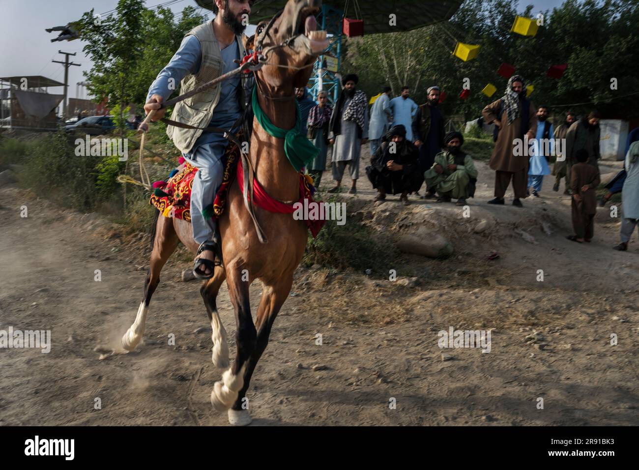 A man rides a horse near Qargha lake in Kabul, Afghanistan, Friday June ...