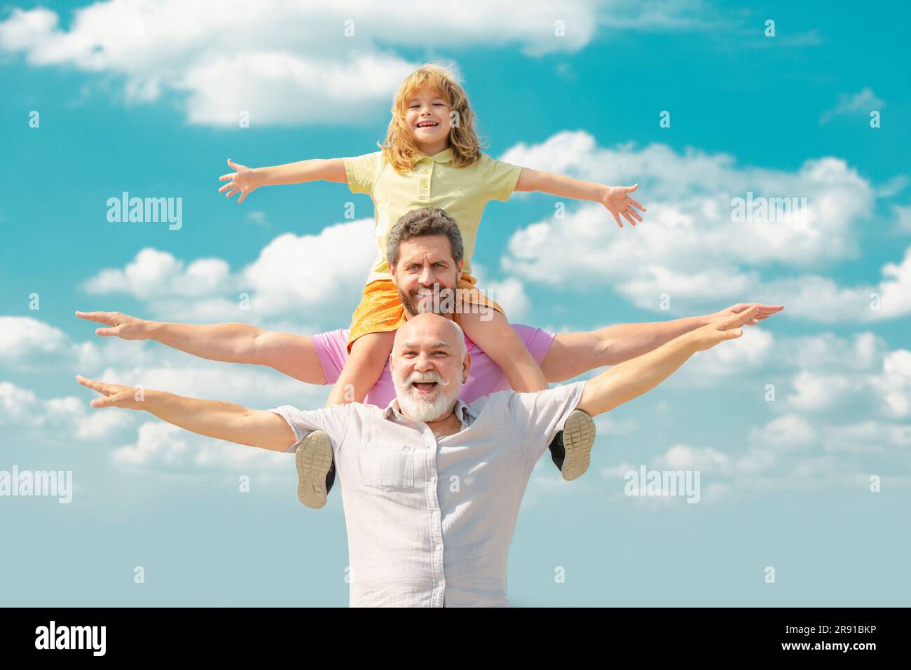 Fathers day. Father and son with grandfather raising hands or open arms ...