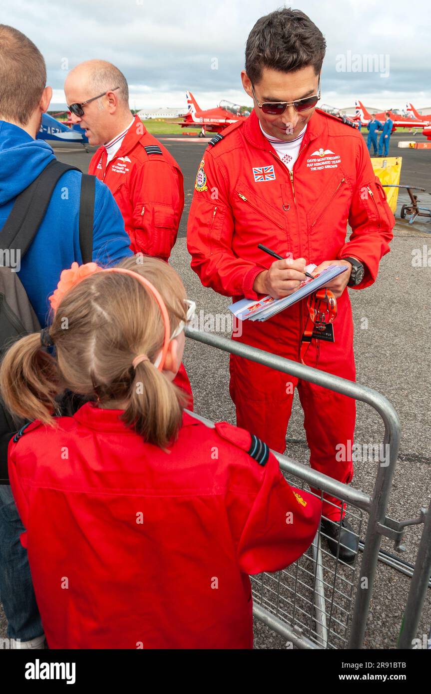 David Montenegro and other Red Arrows pilots signing autographs for ...