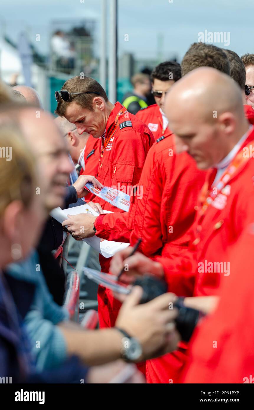 Red Arrows pilots signing autographs for fans at Farnborough airshow ...