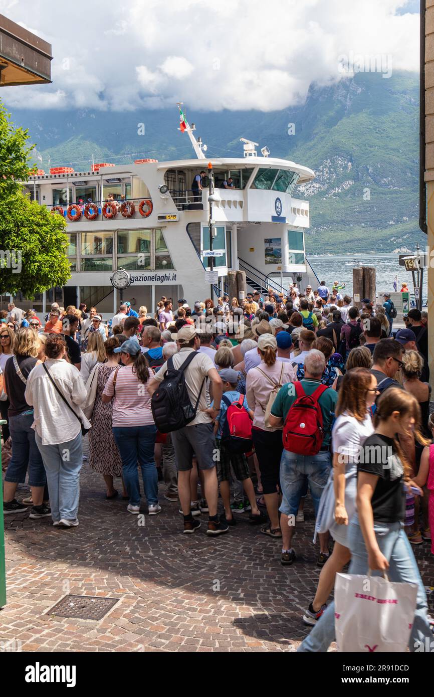 Tourists queuing for the ferry at Limone centro ferry point, Limone ...