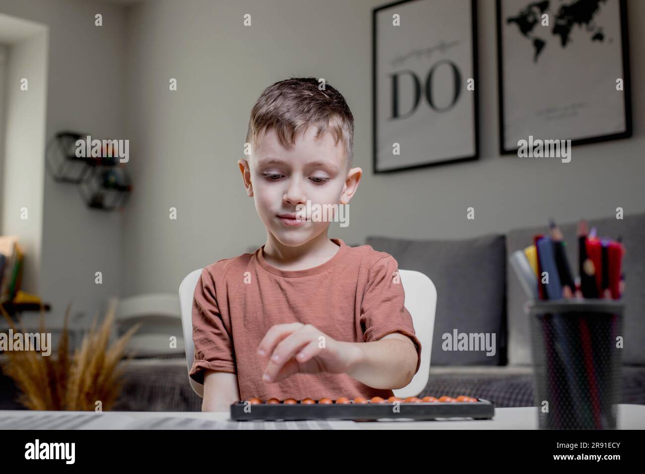 Little boy Counting with help an abacus. Mental arithmetic, brain ...