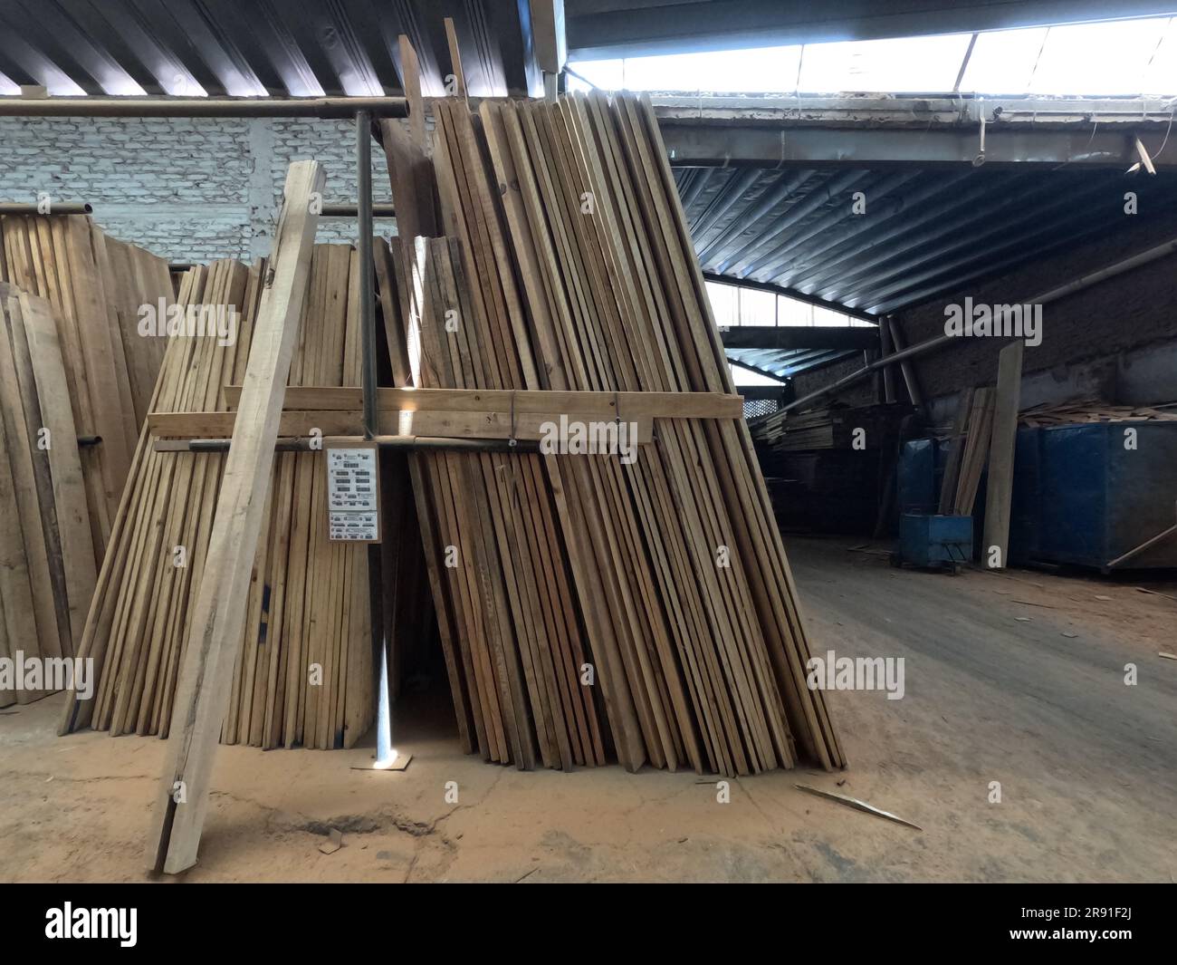 sawmill of industrial architecture, with concrete floor, stove wood ...
