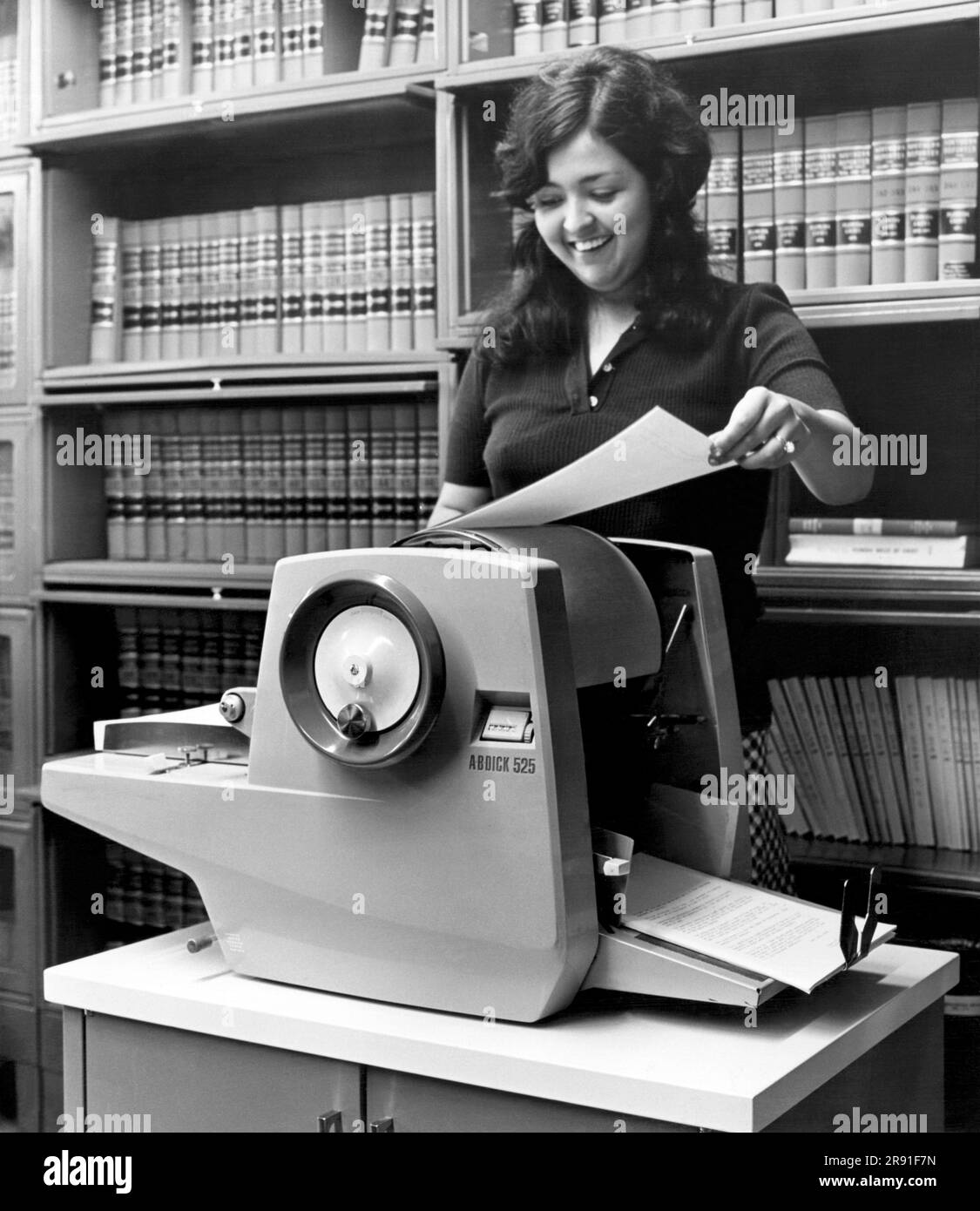 United States: c. 1967 A woman using an A.B. Dick 525 mimeograph ...