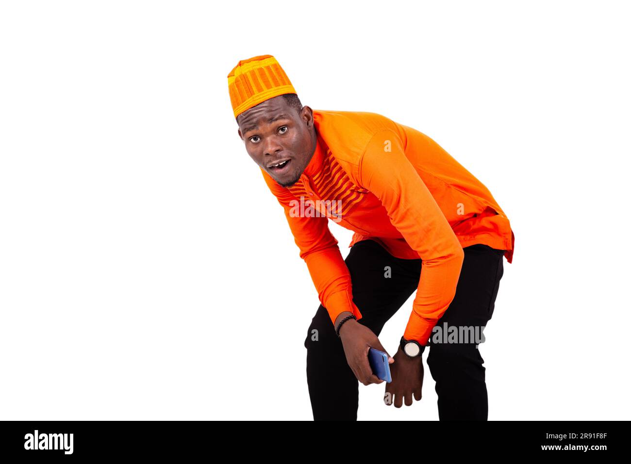 a handsome businessman in orange clothes standing against white ...