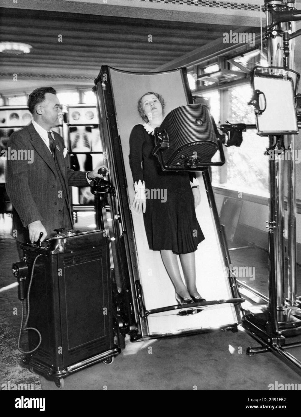 Los Angeles, California: c. 1929 A doctor demonstrates the operation of ...