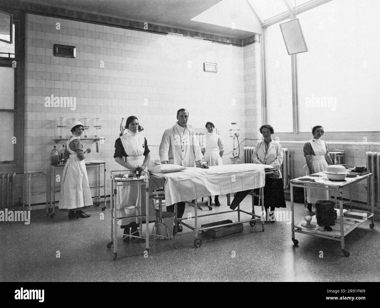Millport, Scotland: c. 1925 A doctor and his nurses pose in their new ...