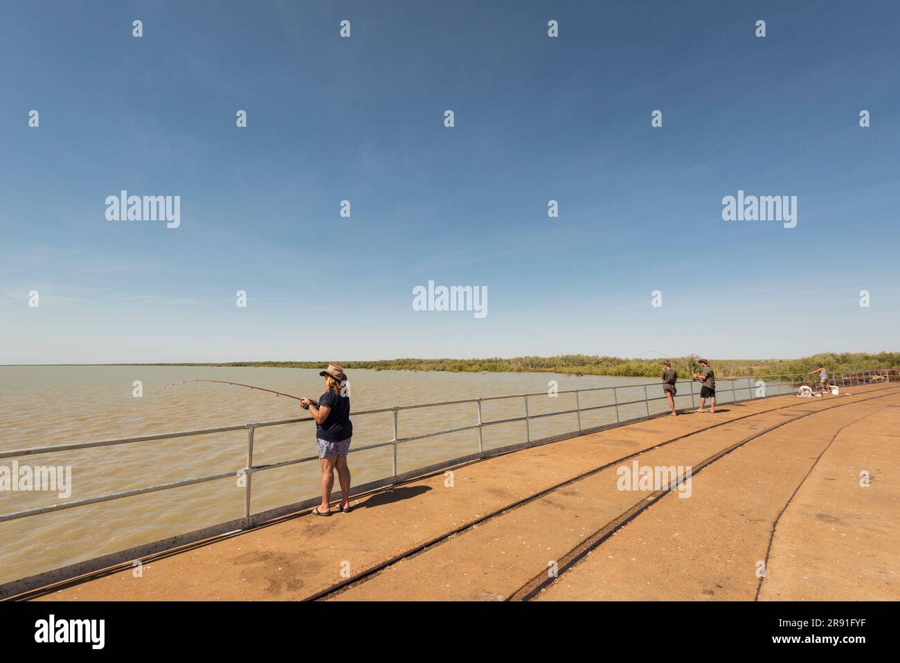People fishing off the jetty at Derby in Western Australia Stock Photo ...