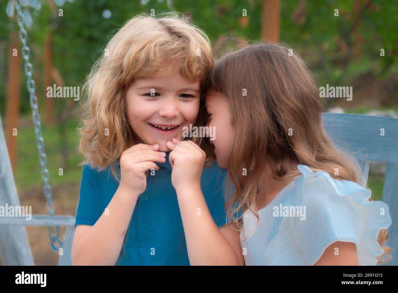 Hugging and kissing kids couple. Little lovely children outdoor ...
