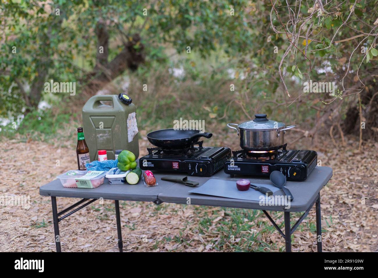 A camp table laid out with cooking equipment at a campsite in Western ...