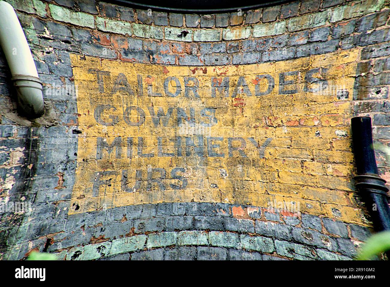 vintage hand painted building sign tailor mades gowns, millinery, furs ...