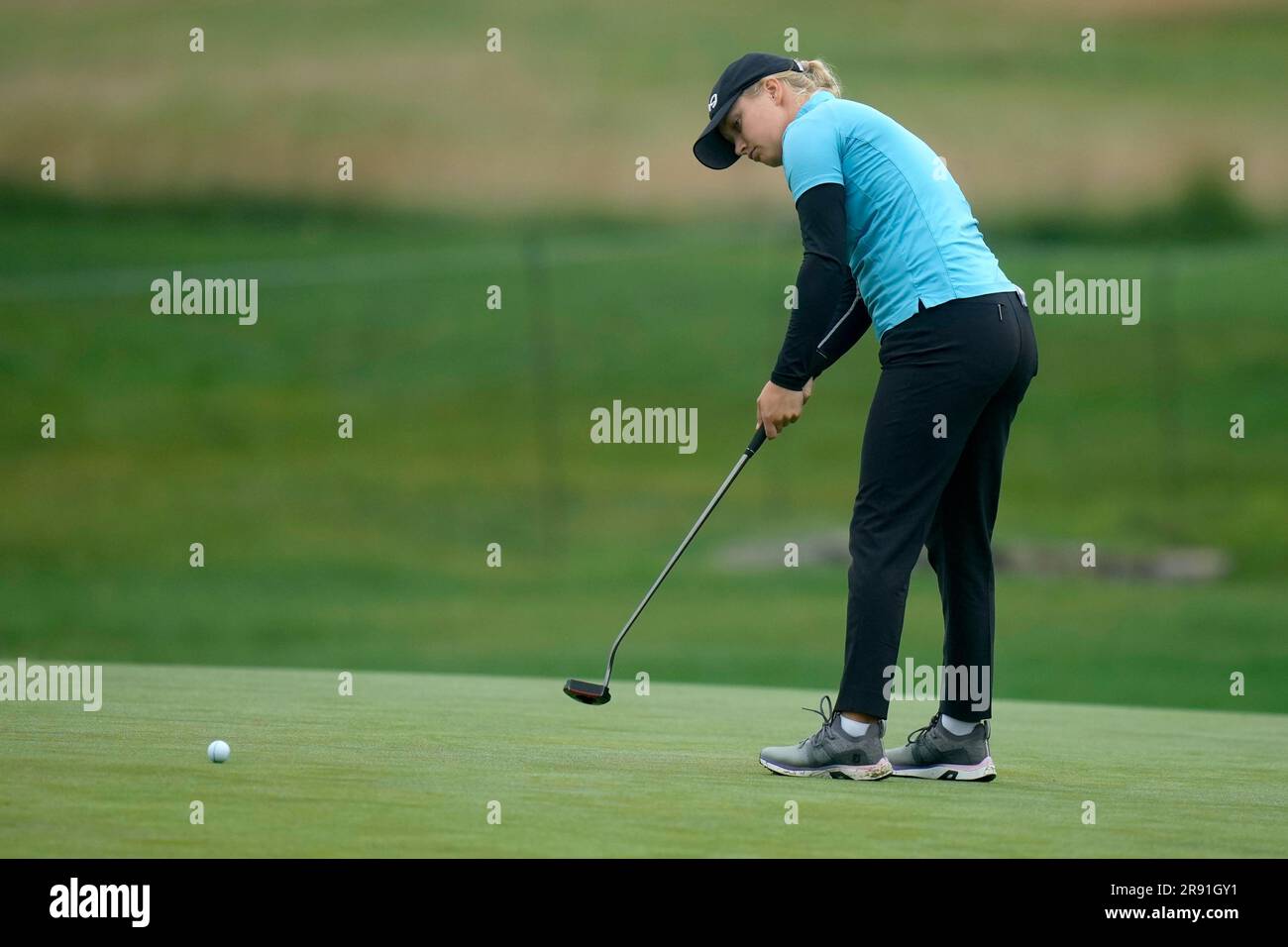 Celine Borge, of Norway, putts on the third hole during the second ...