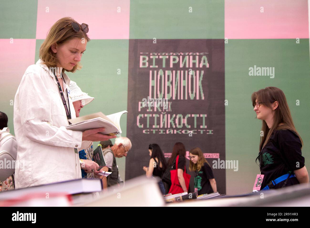 KYIV, URKAINE - JUNE 22, 2023 - A woman looks through a book at the ...