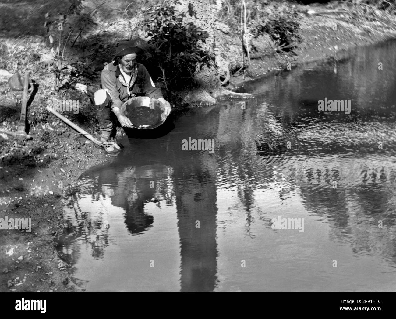 Gold panning prospecting Black and White Stock Photos & Images - Alamy